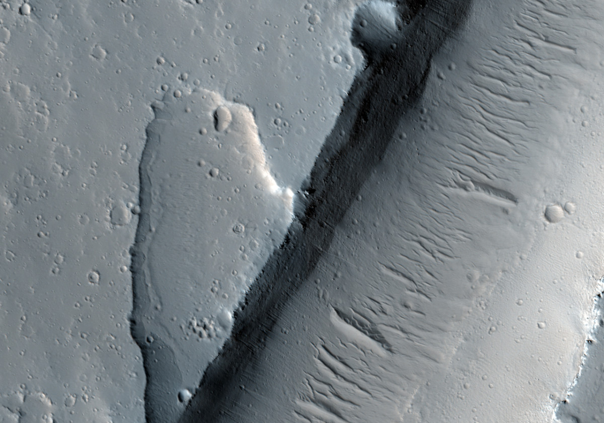 Channels and Lava Flows on the Tharsis Plateau | Mars From Space